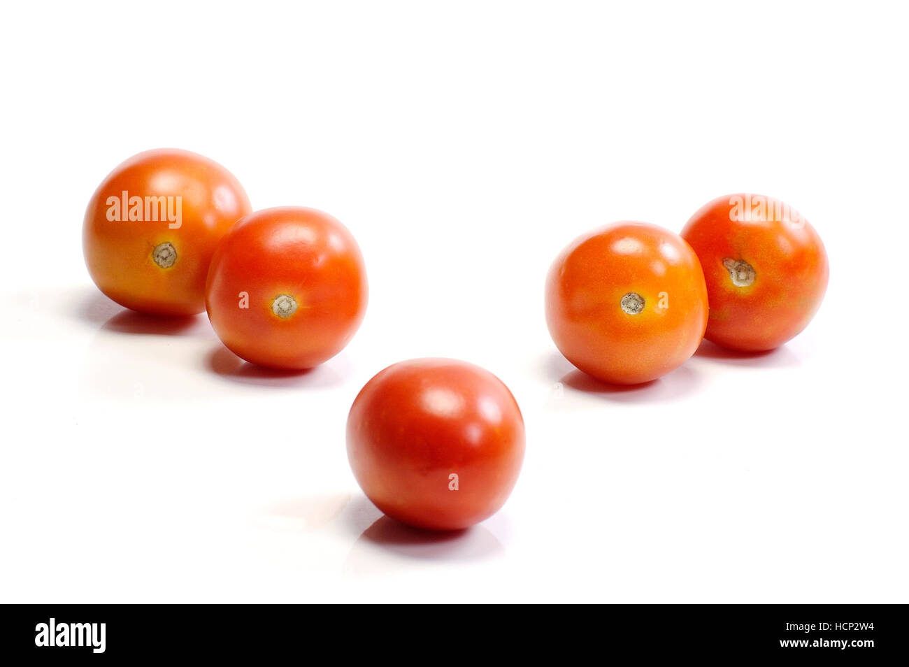Five tomatoes on white background. Look tasty and fresh Stock Photo - Alamy