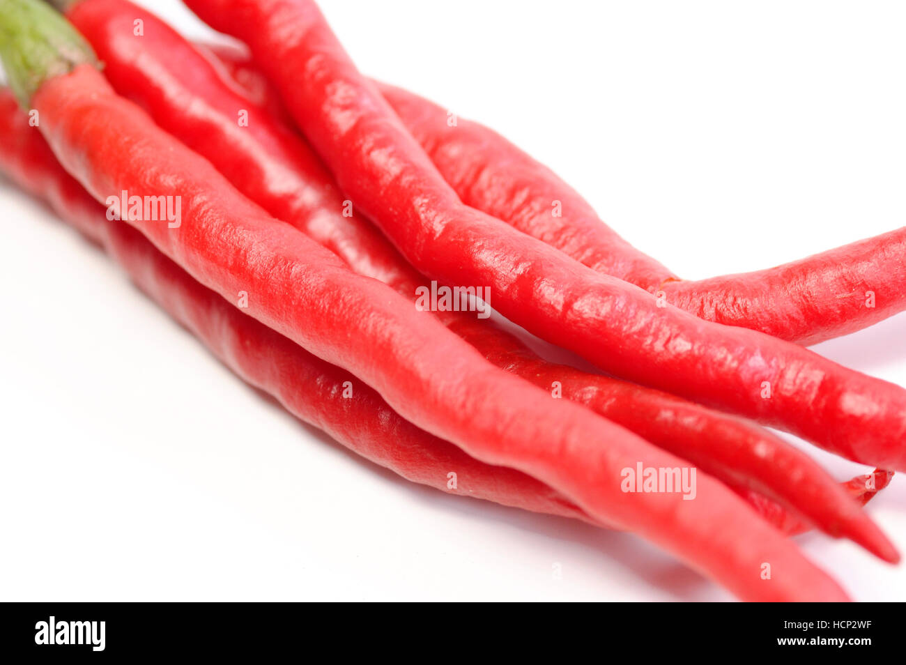 Five Red Hot Chili Peppers on White Background Stock Photo - Alamy