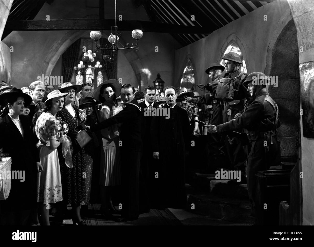 WENT THE DAY WELL?, from left starting with Arthur Ridley (tall, gray ...