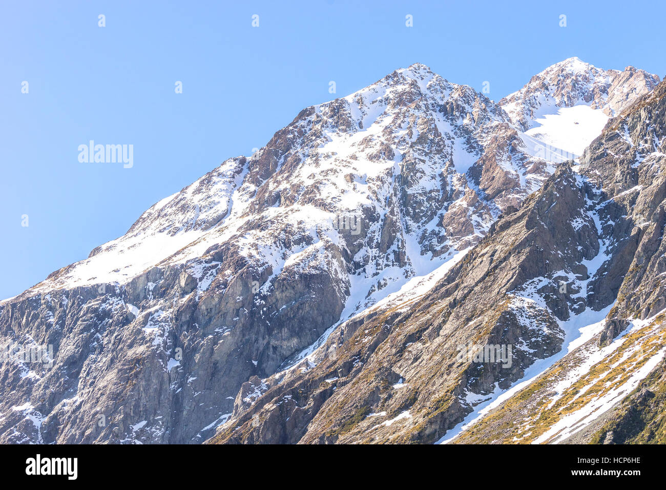 View of top mountain cook with white snow and rock texture Stock Photo ...