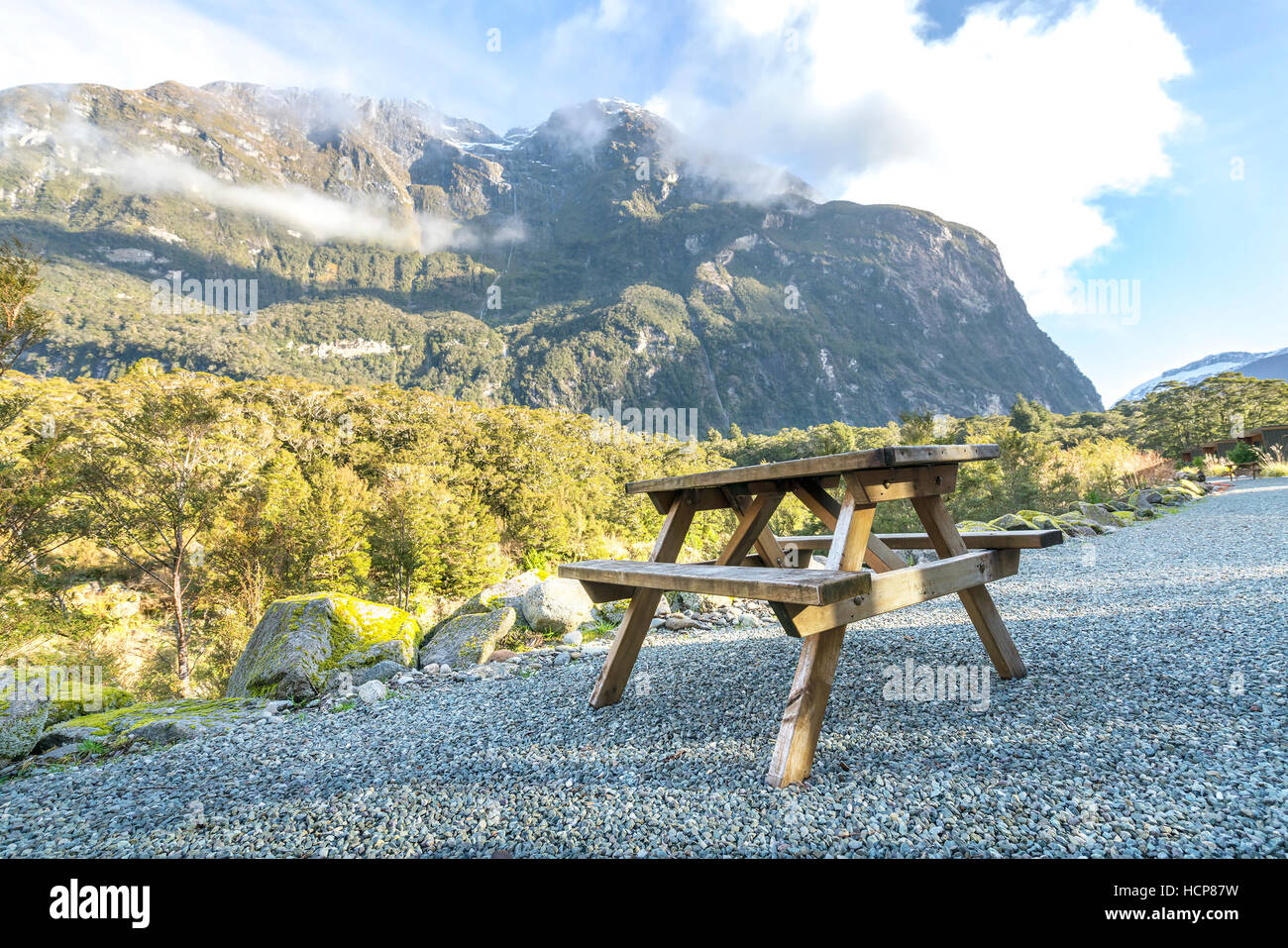 Wooden bench with mountain background Stock Photo - Alamy
