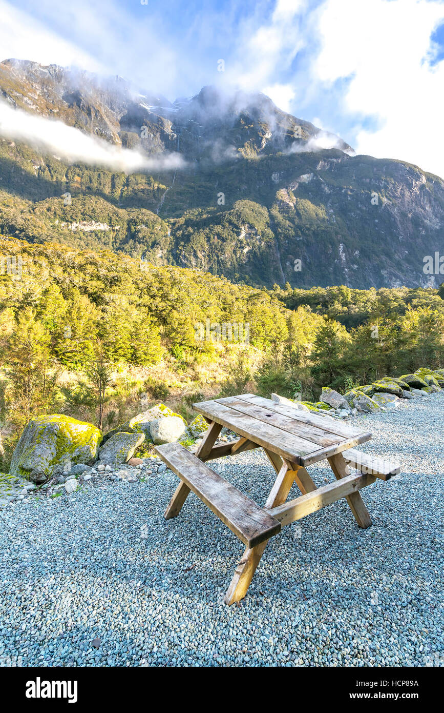 Wooden bench with mountain background Stock Photo - Alamy