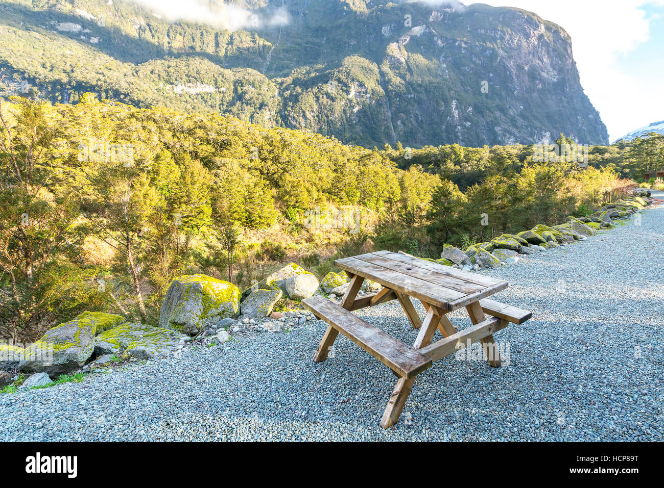 Wooden bench with mountain background Stock Photo - Alamy