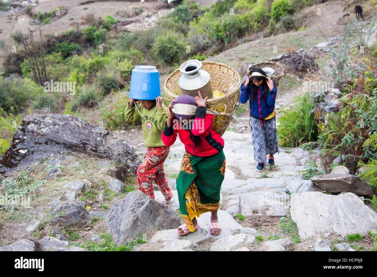 Women carrying water hi-res stock photography and images - Alamy