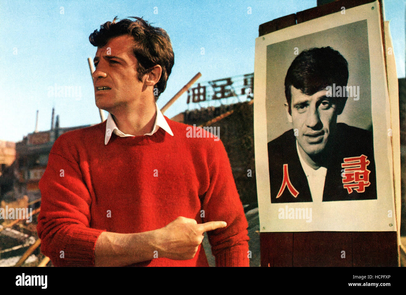 UP TO HIS EARS, Jean-Paul Belmondo, 1965, pointing to Chinese wanted ...