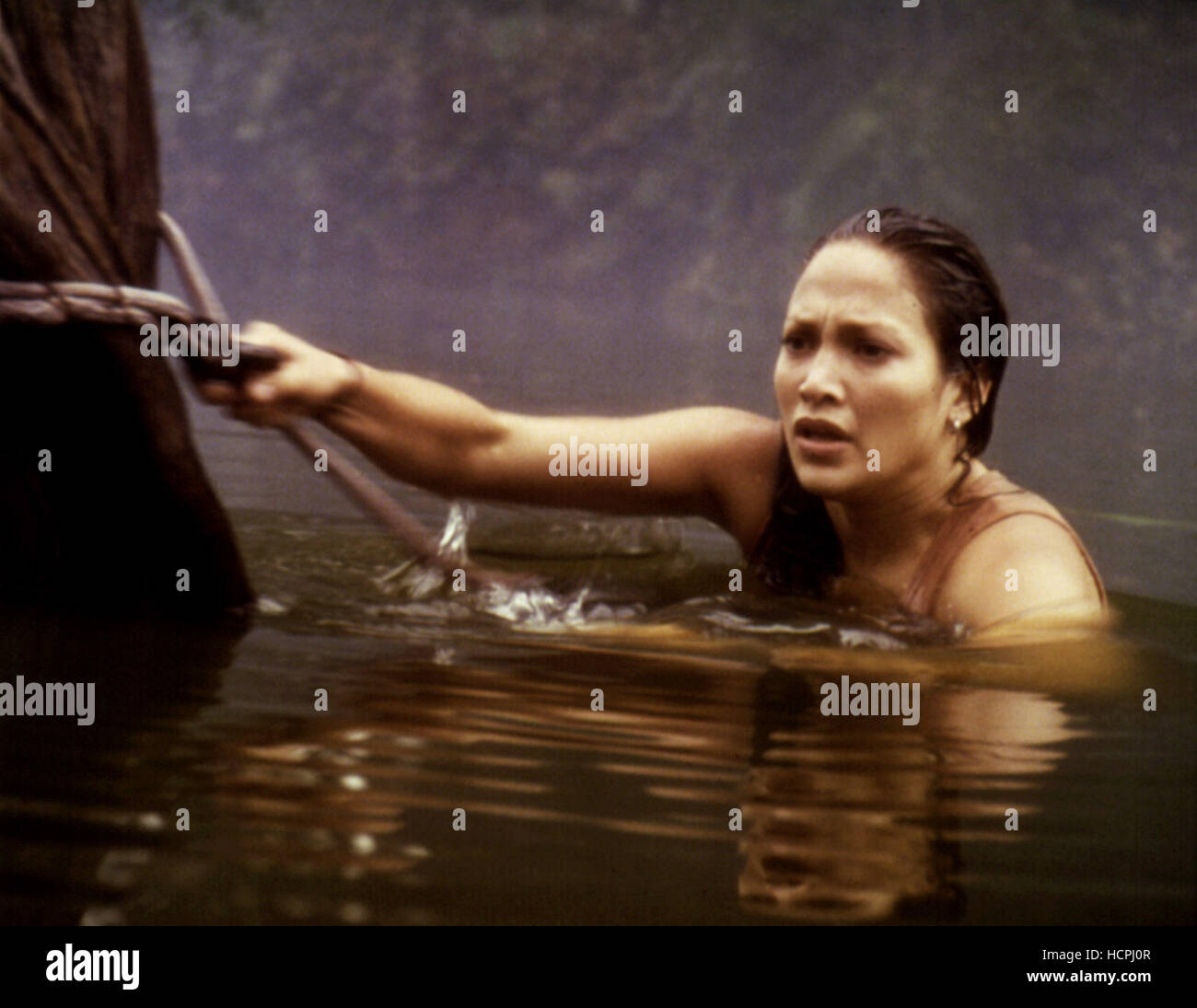 ANACONDA, Jennifer Lopez, 1997, holding on to the rope Stock Photo - Alamy
