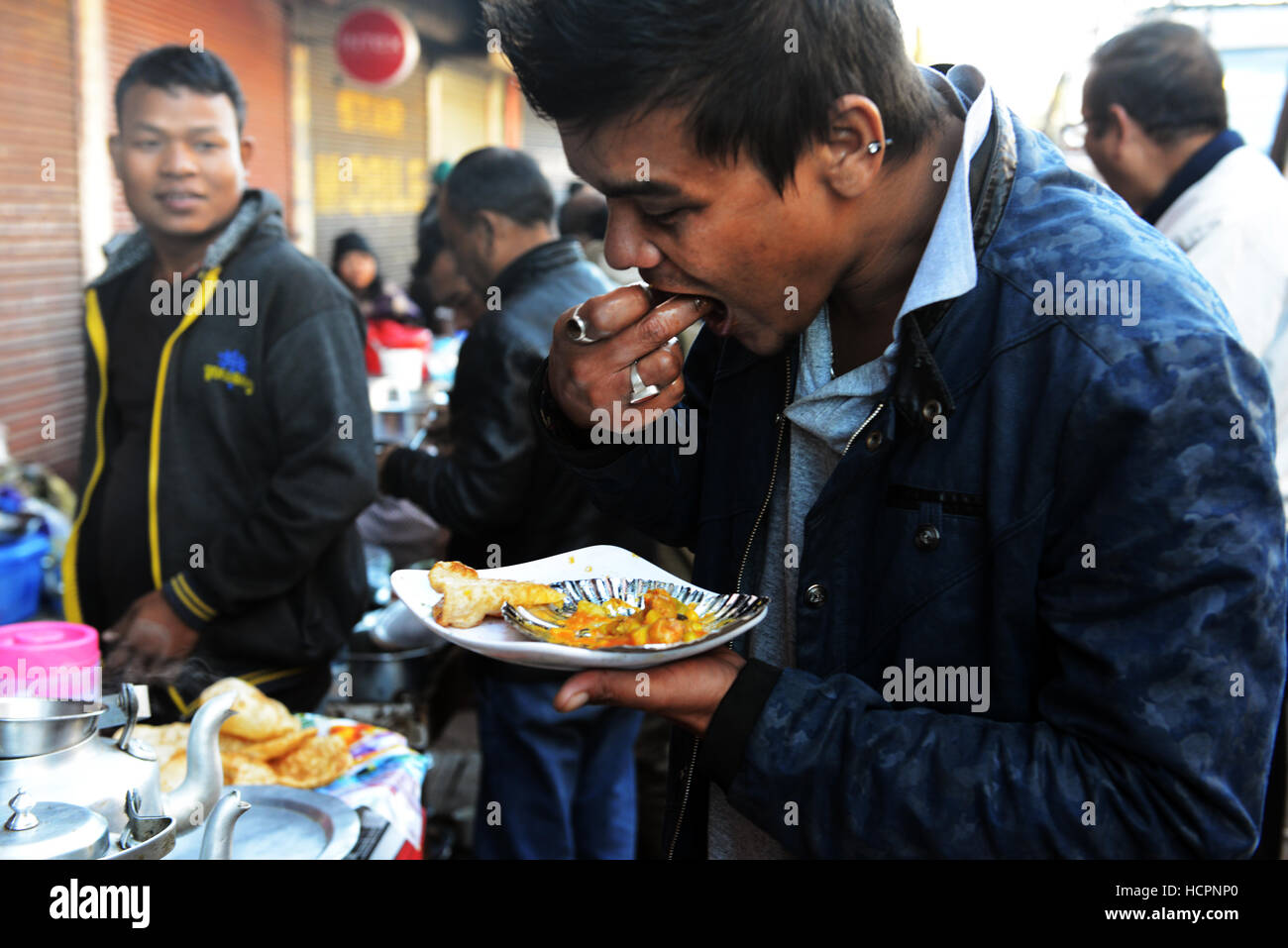 Indian man eating breakfast hi-res stock photography and images - Alamy