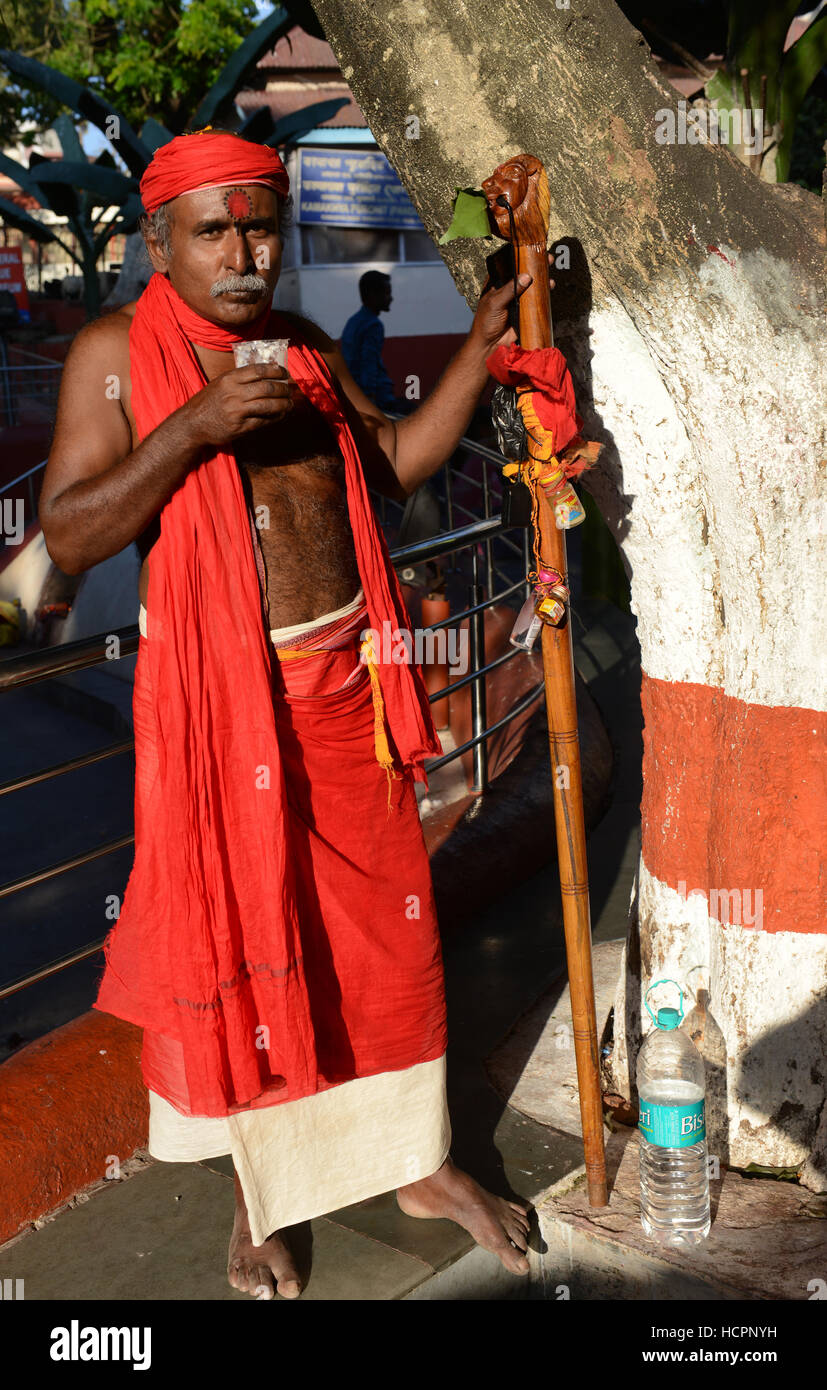 Portrait of a Shakti following pilgrim dressed in red Stock Photo - Alamy