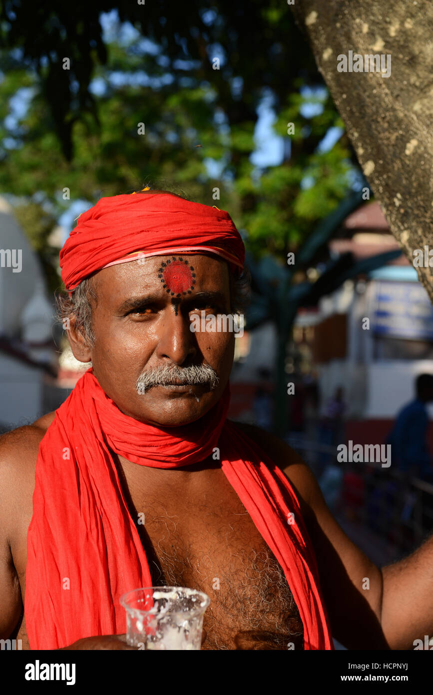 Portrait of a Shakti following pilgrim dressed in red Stock Photo - Alamy