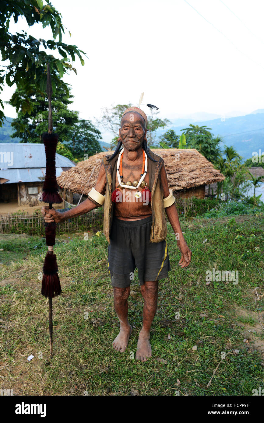 Portrait of a tattooed head hunter warrior from the Konyak tribe in ...