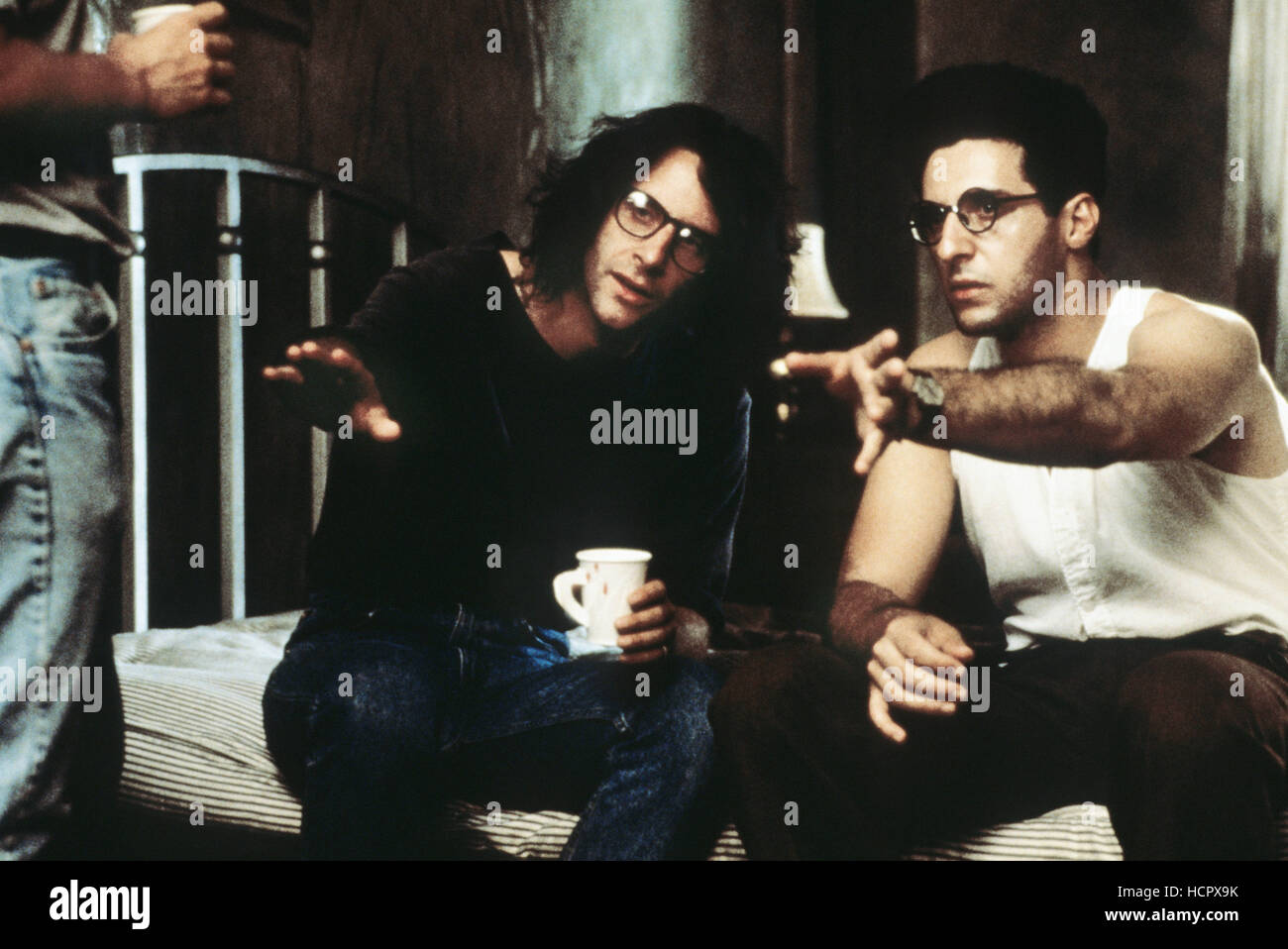 BARTON FINK, from left: director Joel Coen, John Turturro on set, 1991, TM & Copyright © 20th ...