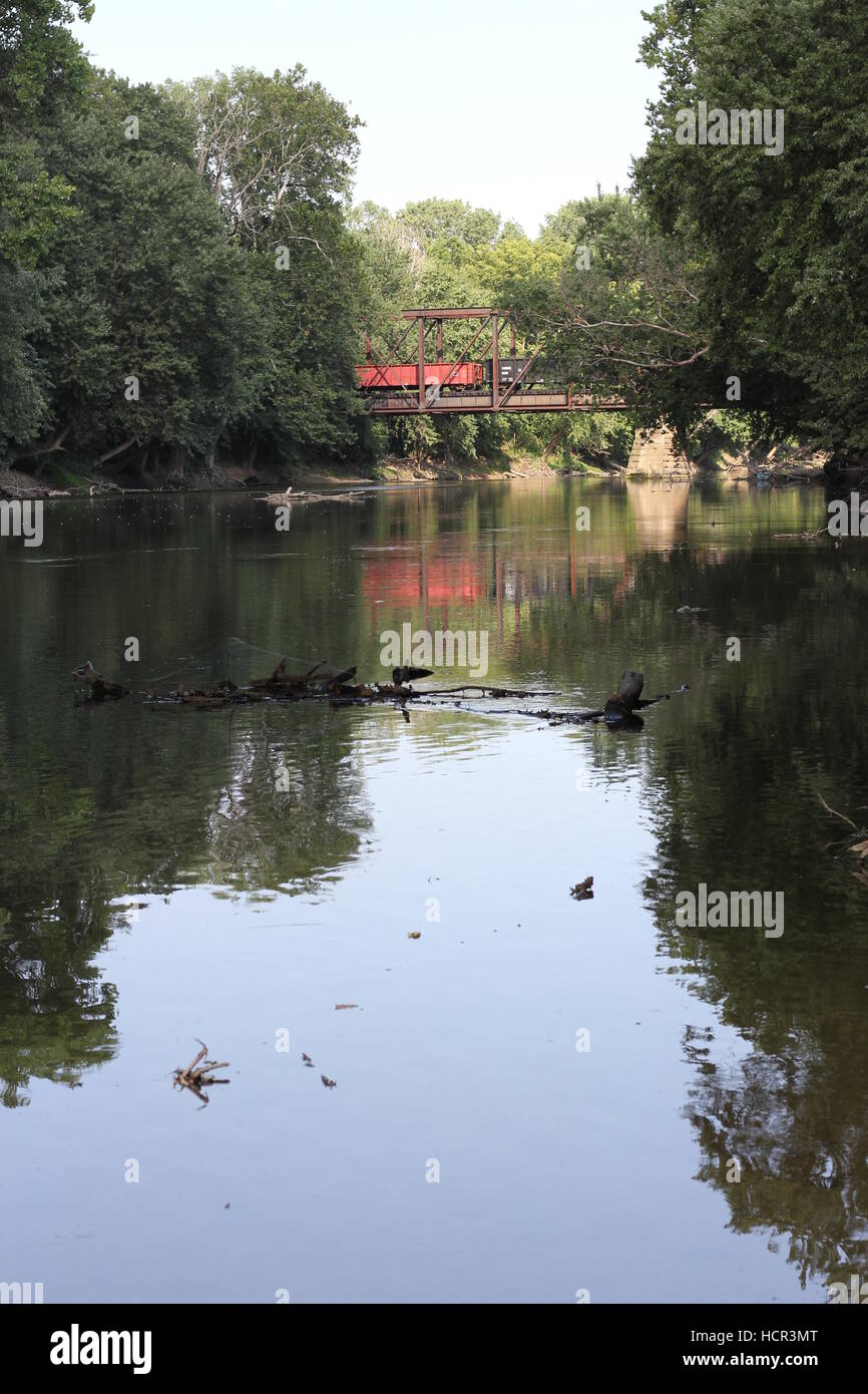 A train crosses a bridge over the lazy Maumee River at New Haven ...