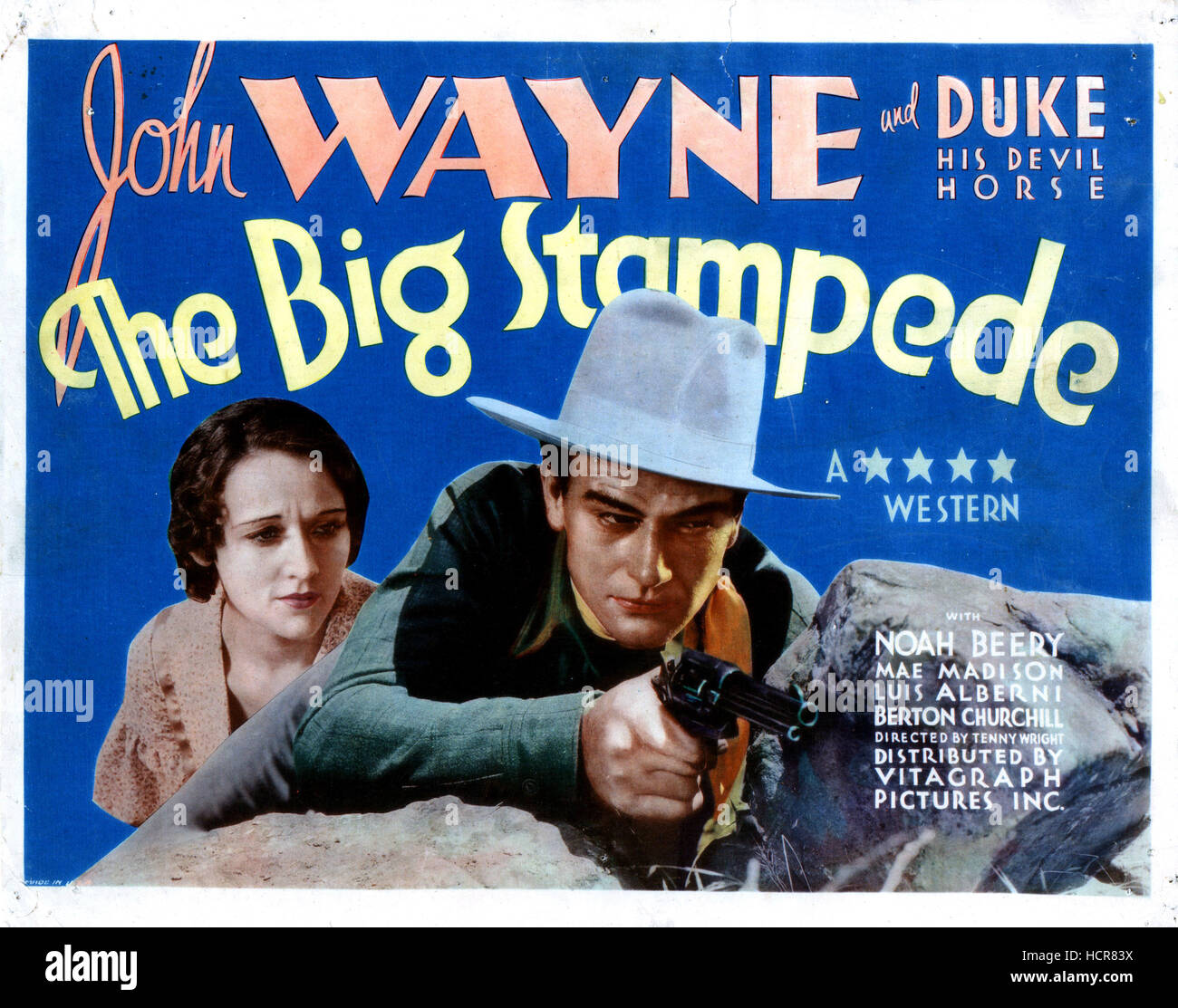 THE BIG STAMPEDE, from left, Mae Madison, John Wayne, 1932 Stock Photo ...
