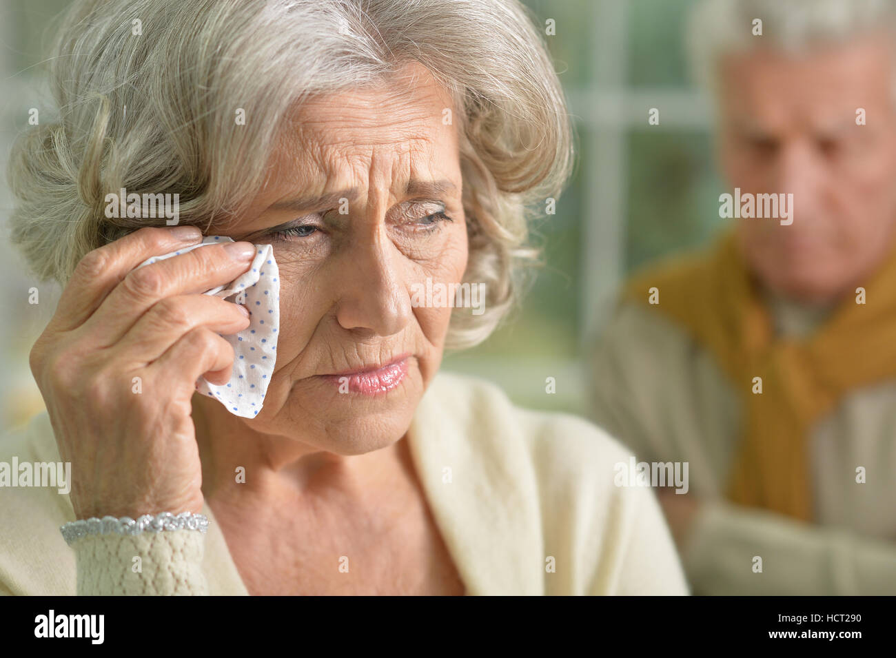 Sad senior woman Stock Photo - Alamy