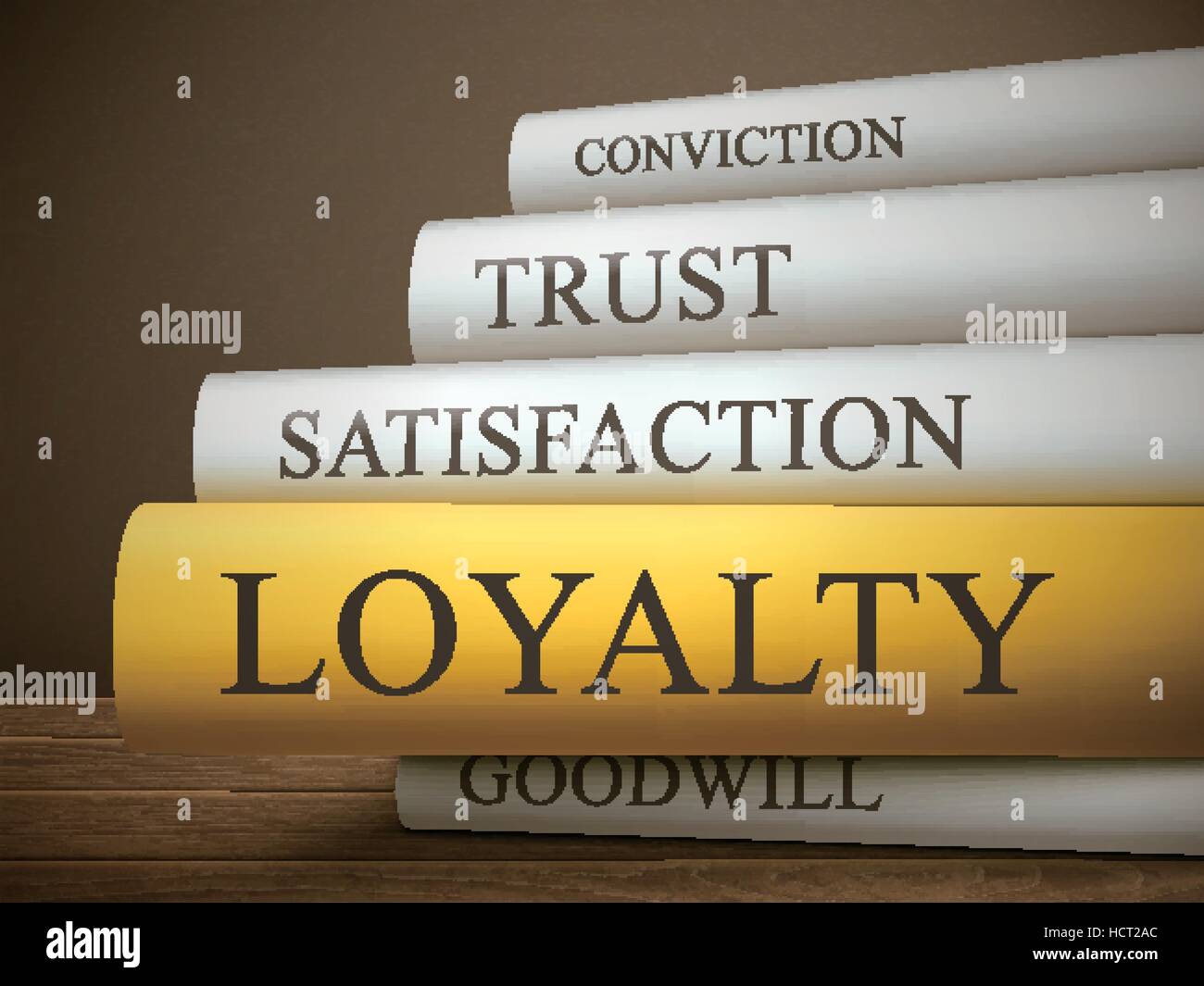 book title of loyality isolated on a wooden table over dark background ...