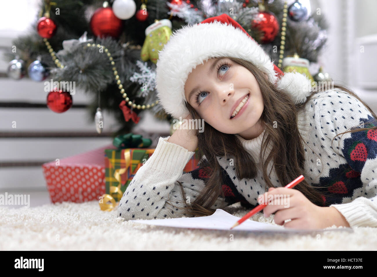 Girl writing letter Stock Photo - Alamy