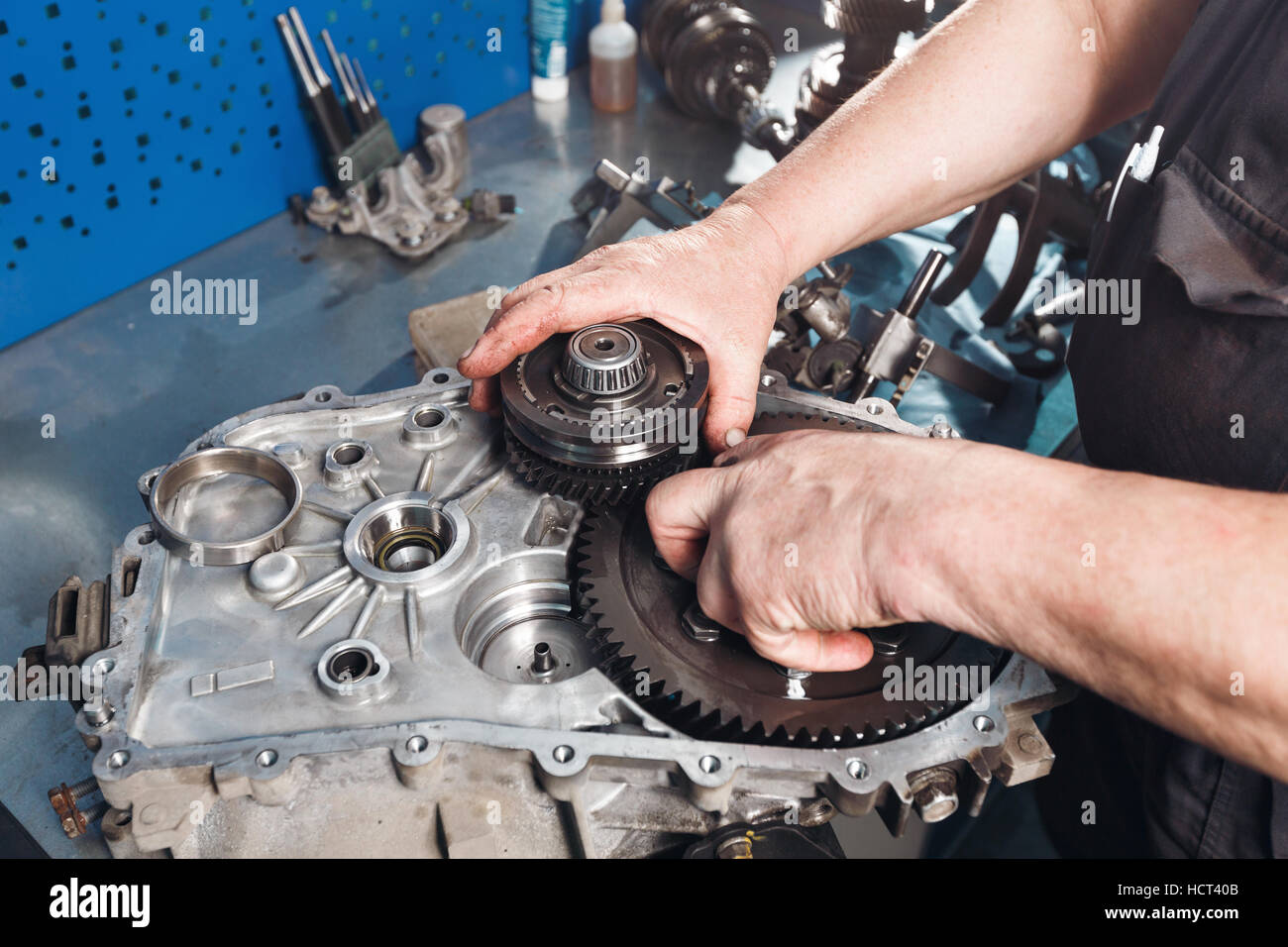 Cross-section of a car gearbox. mechanics work in the garage. hand ...