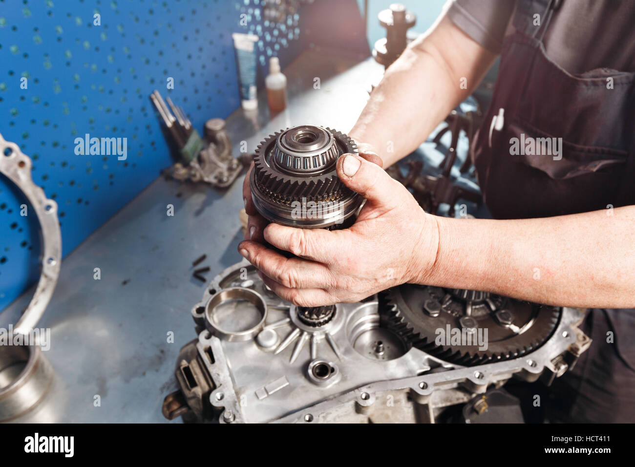 Cross-section of a car gearbox. mechanics work in the garage. hand ...