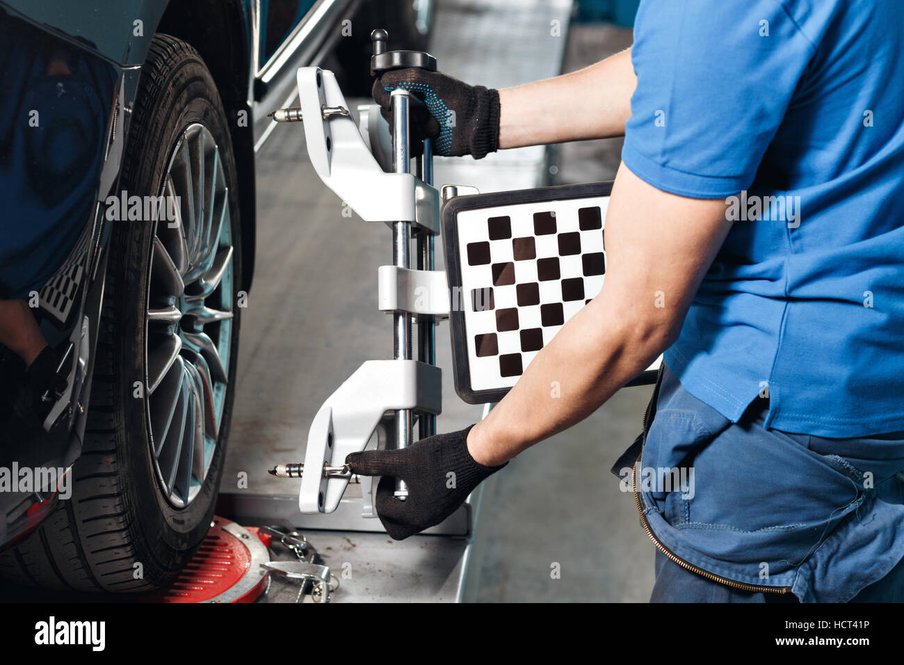 Grid sensor sets mechanic on auto. Car stand with sensors wheels for ...