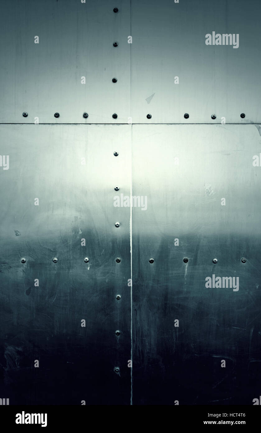 Metal background with rivets, detail of a steel background texture ...