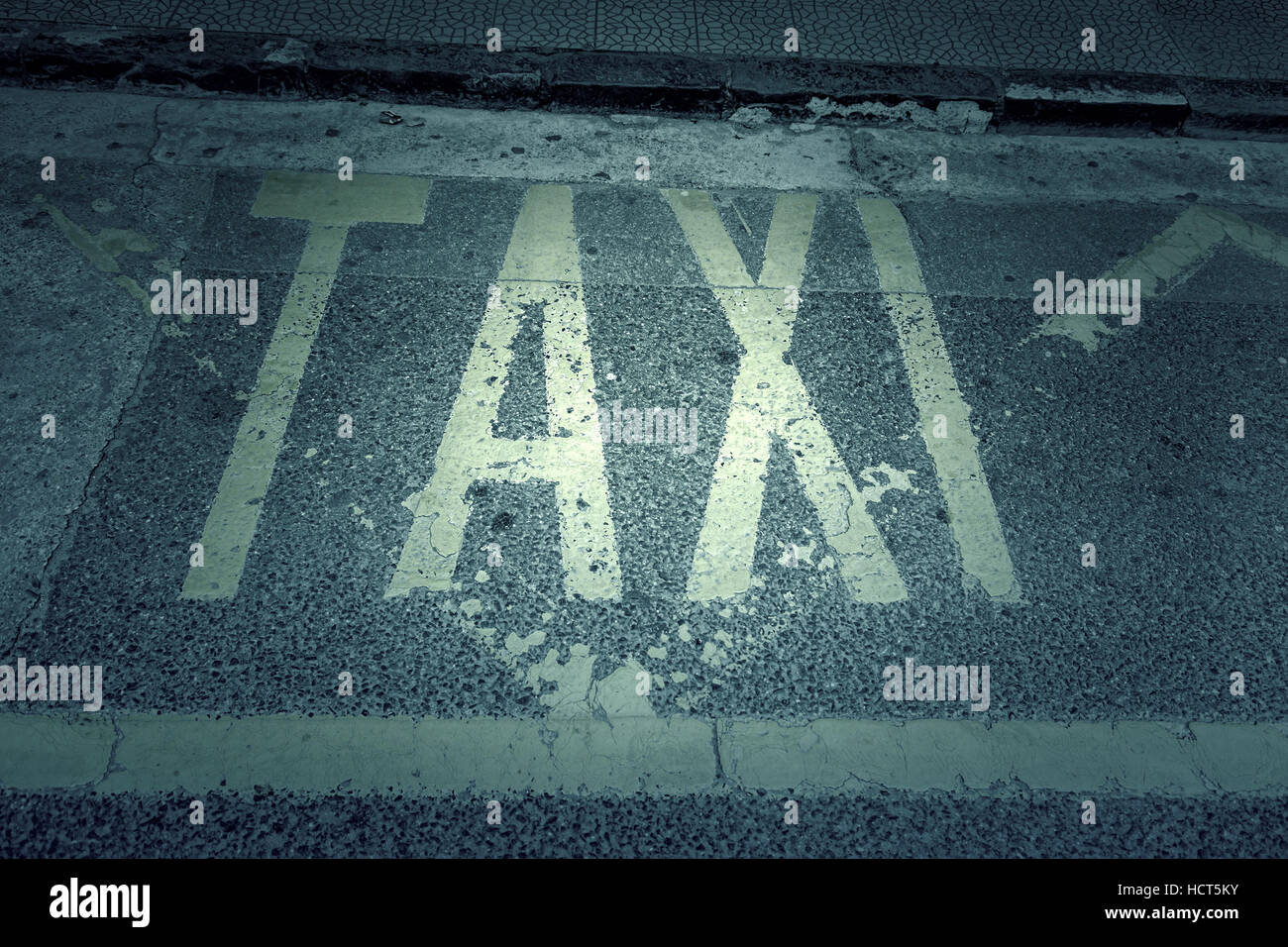 Taxi sign on asphalt, detail of a traffic signal, information and ...