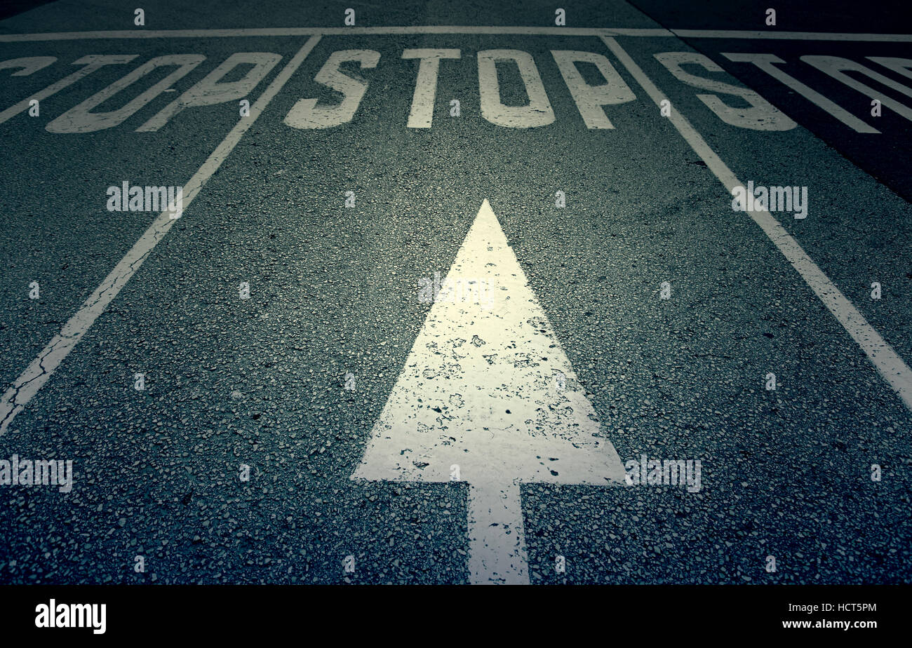 Stop sign on asphalt, detail of a traffic signal Stock Photo - Alamy