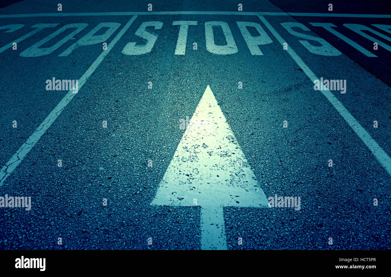 Stop sign on asphalt, detail of a traffic signal Stock Photo - Alamy