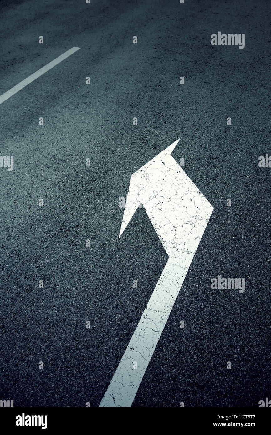 Arrow on the road, driver education detail Stock Photo - Alamy