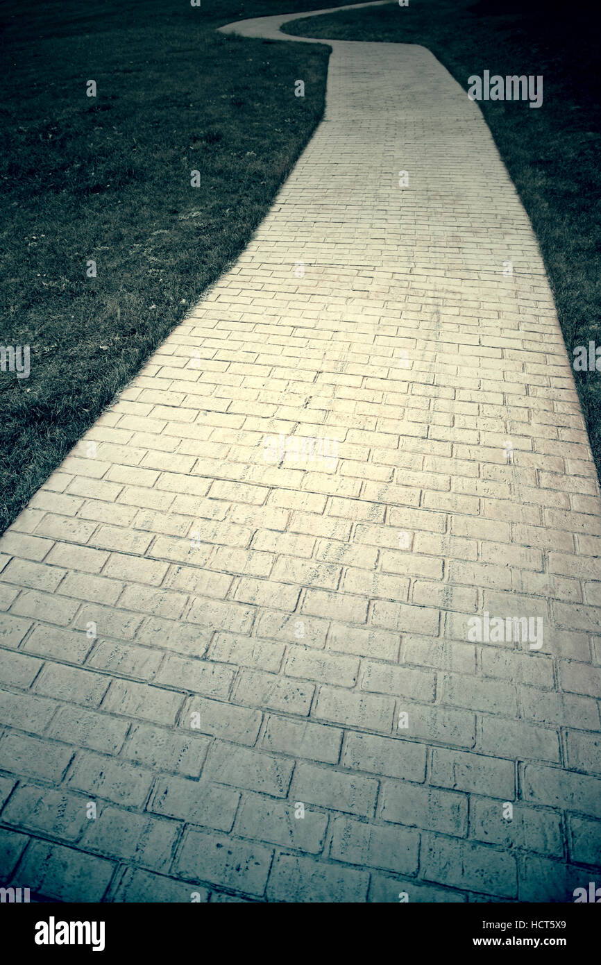 Road in the countryside, detail of a brick road, depth Stock Photo - Alamy