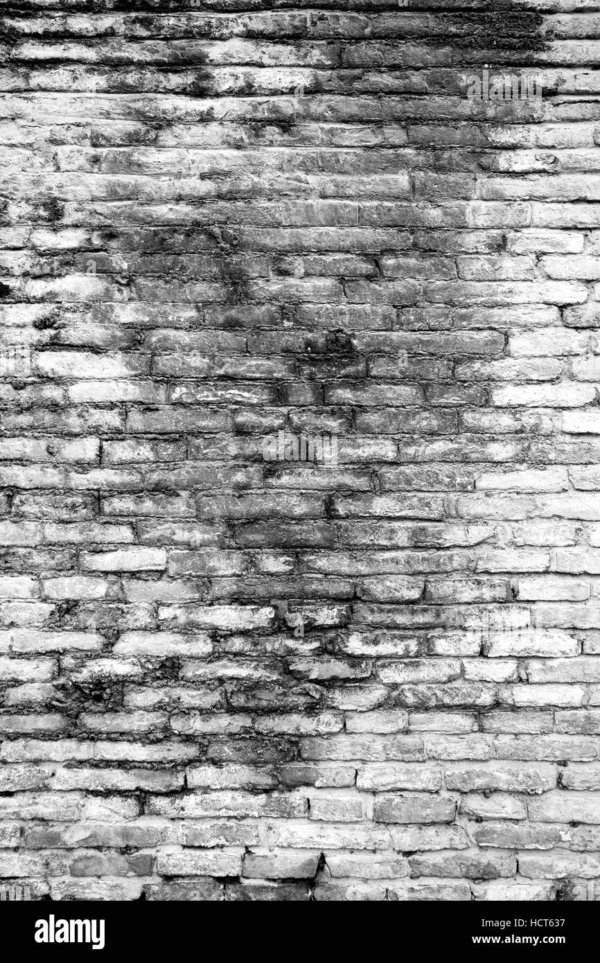 Old broken brick wall, detail of a textured background brick wall in a ...