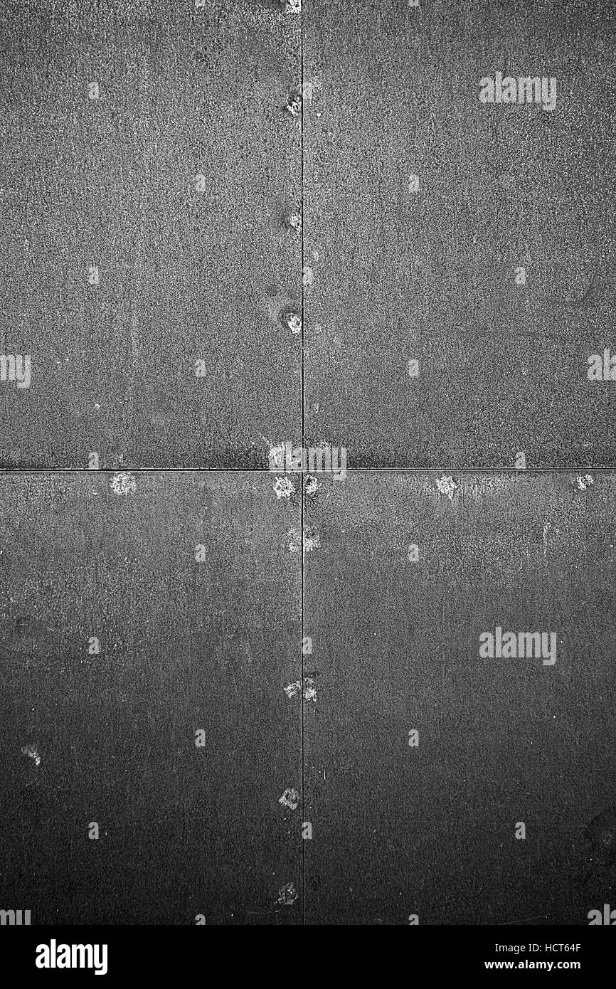 Metal wall section detail of the city wall, rusty metal on the street ...