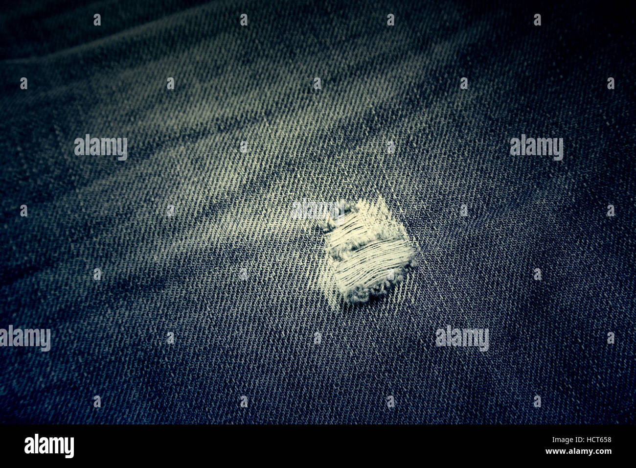 Jeans fabric texture, detail of torn trousers, textile textured ...