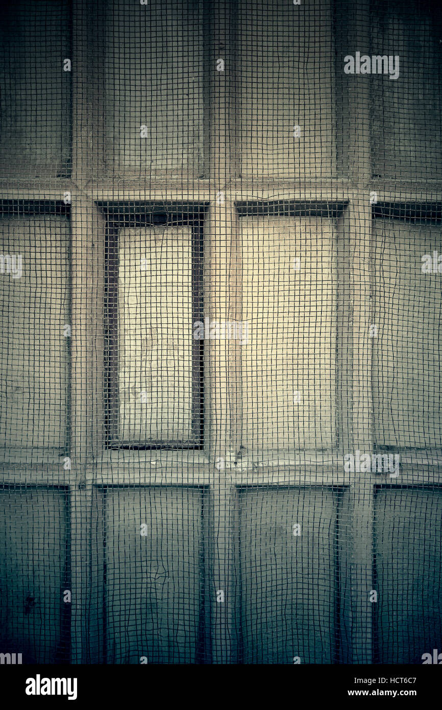 Cement closed window, detail of window protected by a metal fence ...