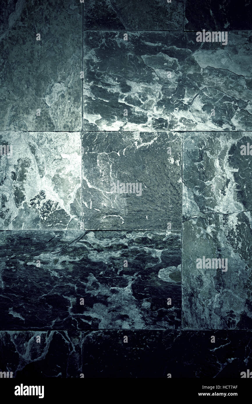 Rusty stone wall, detail of a wall of stone tiles, textured background ...