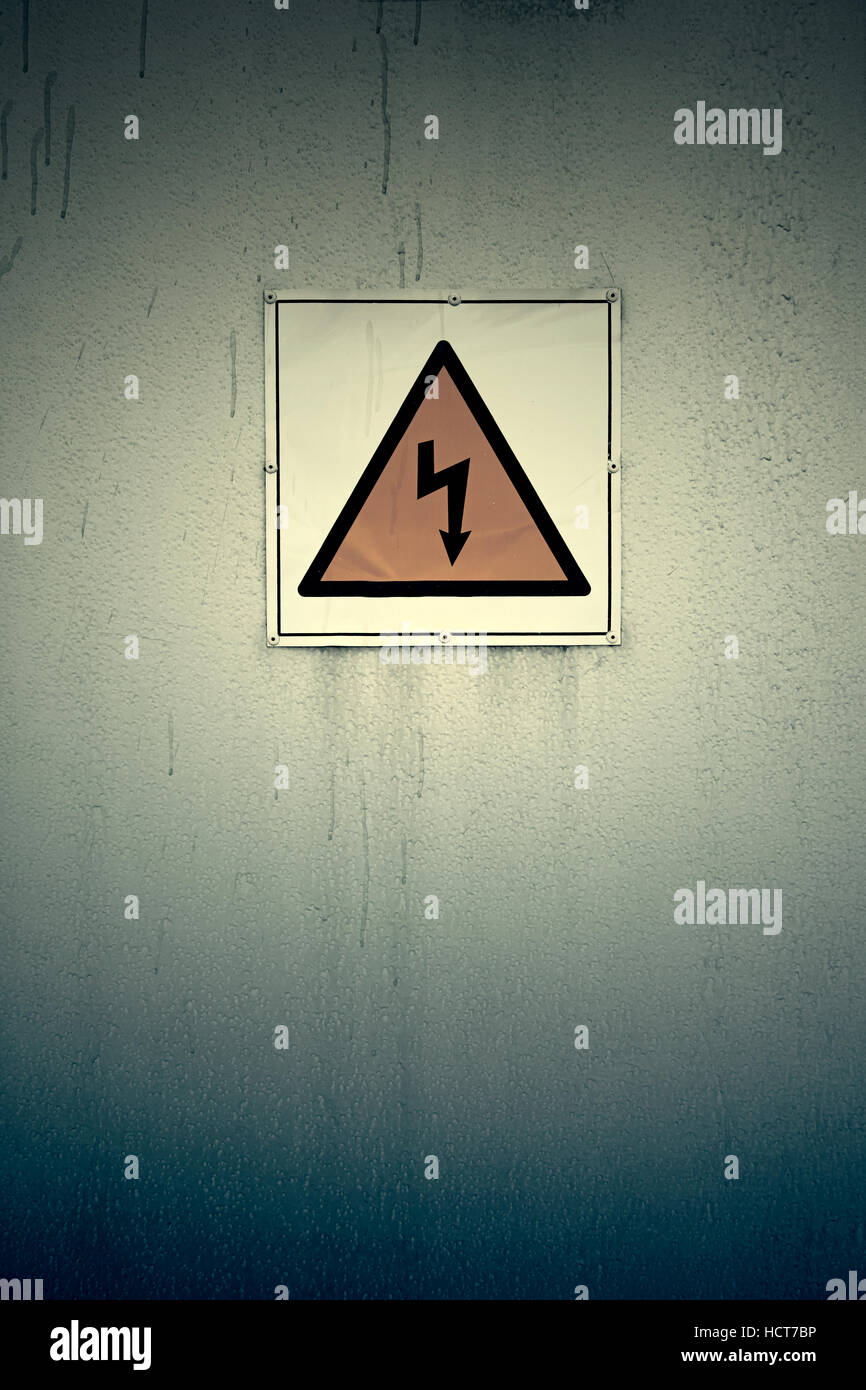 Electrical warning sign, detail of a caution sign on a metal wall ...