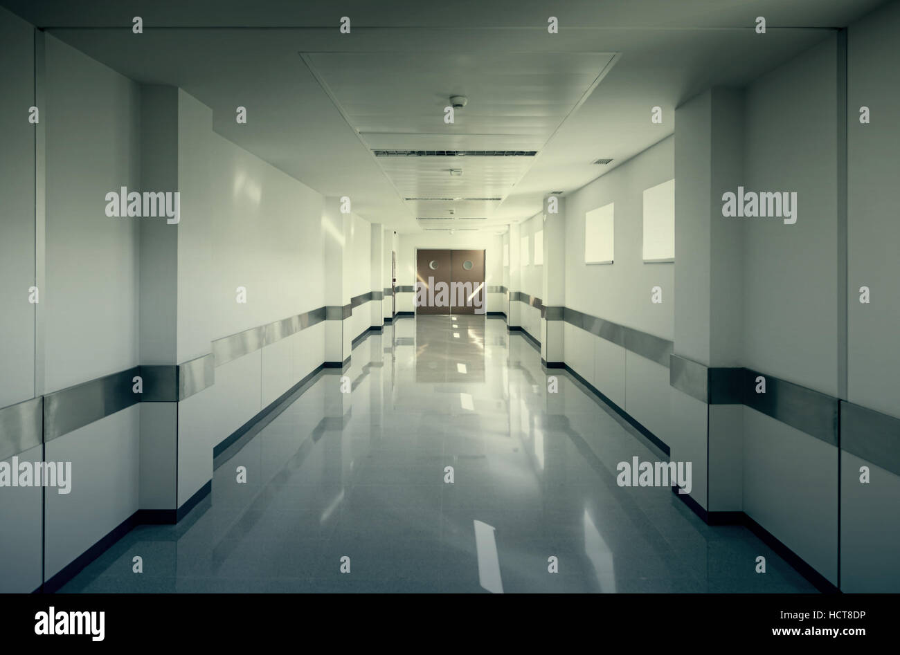 Deep hospital corridor, detail of a white corridor in a hospital ...