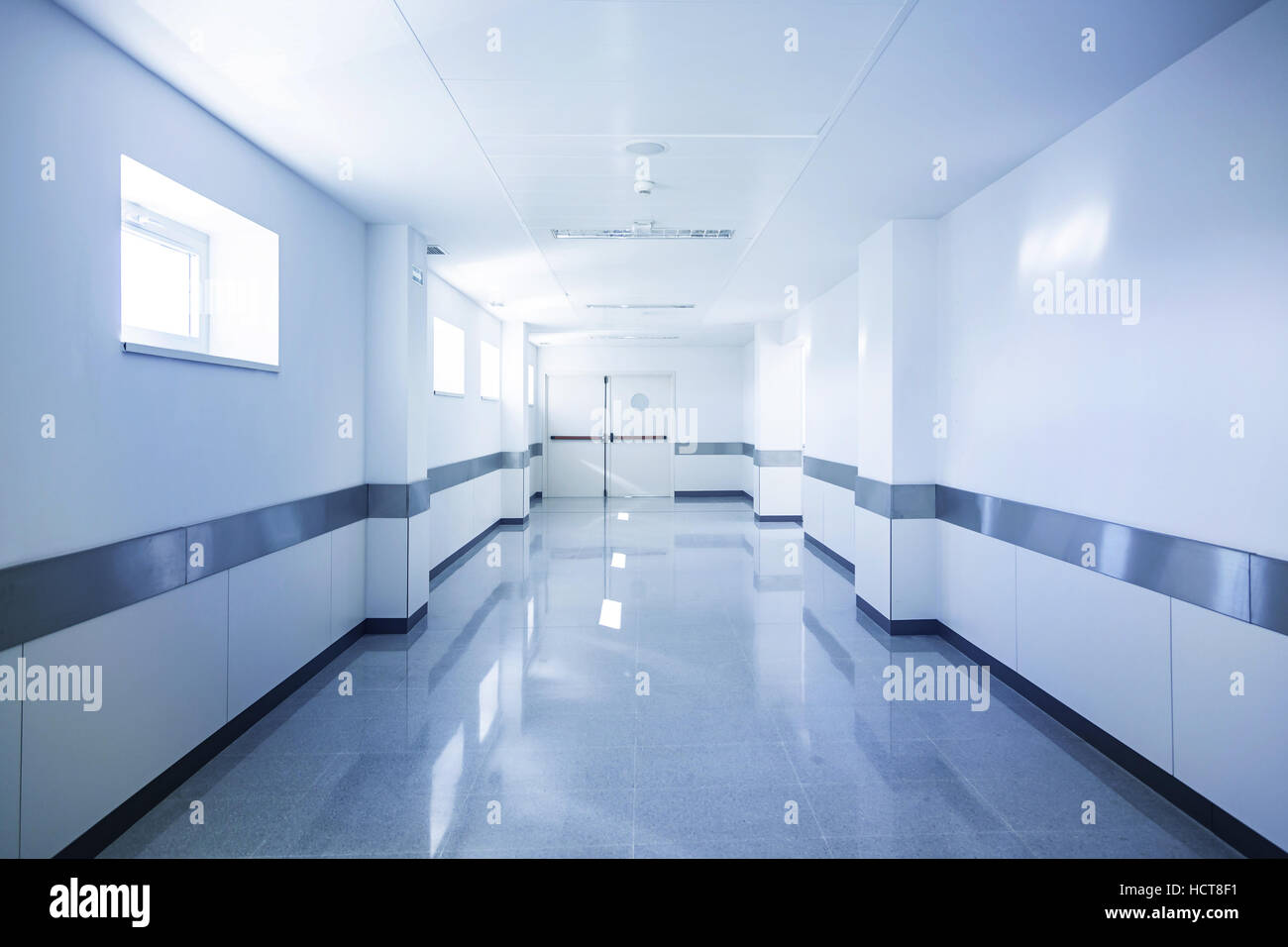 Deep hospital corridor, detail of a white corridor in a hospital ...