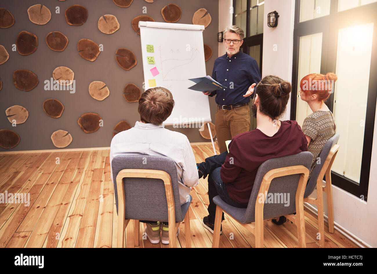 Group young workers working hi-res stock photography and images - Alamy