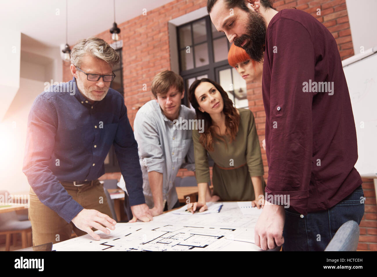 Brainstorming of stylish and creative architects Stock Photo - Alamy