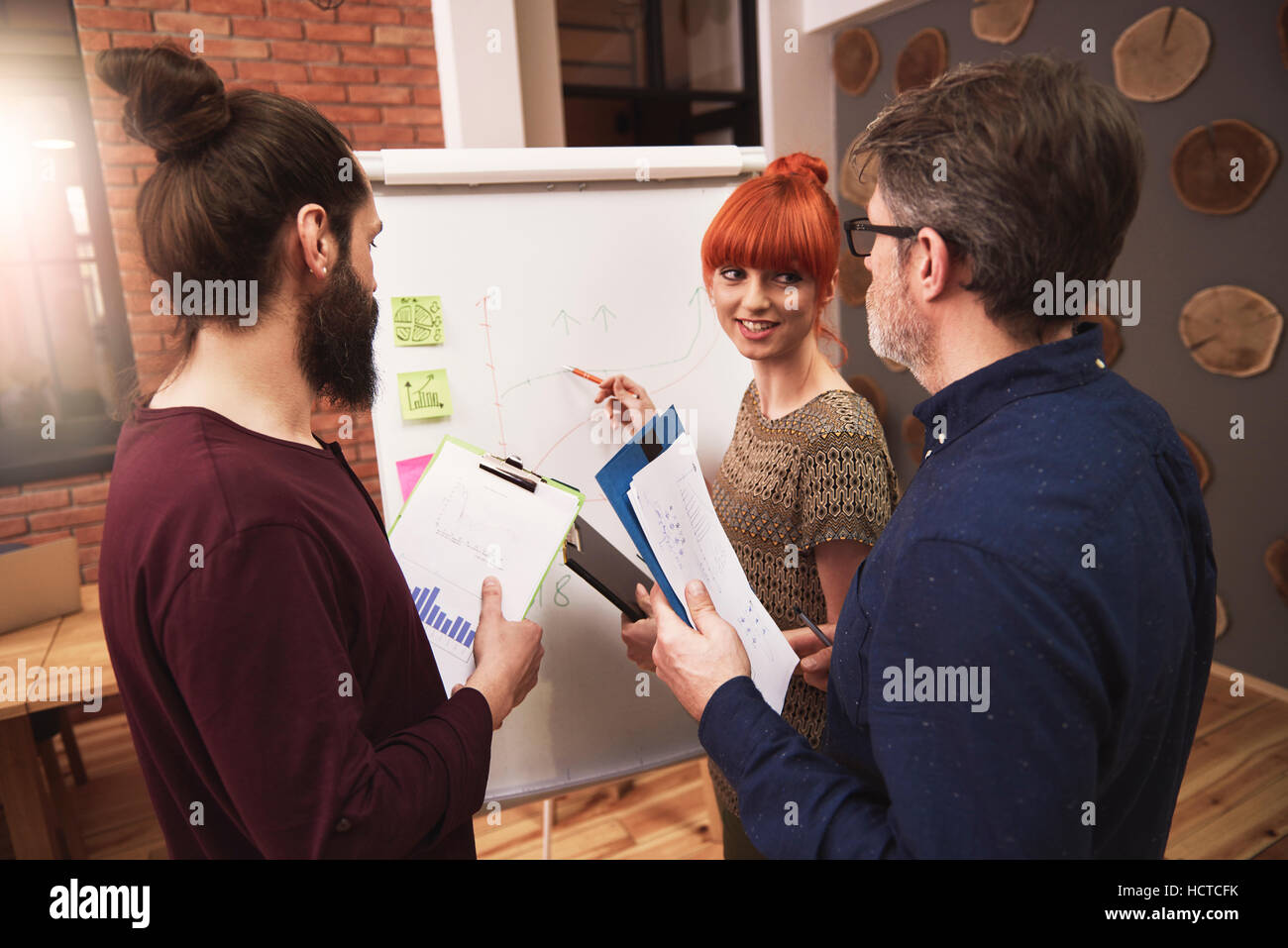 Group of people analyzing the result of work Stock Photo - Alamy