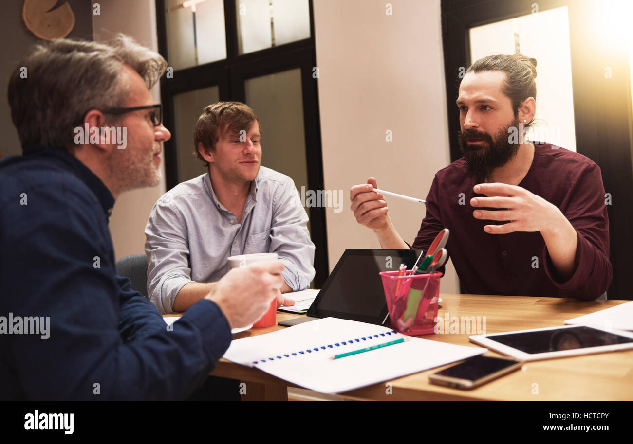 Talking men about business project Stock Photo - Alamy
