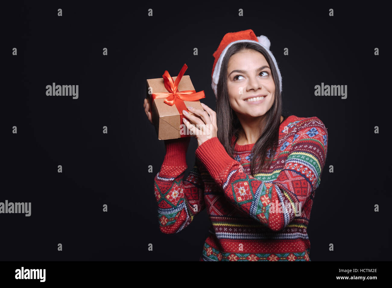 Delighted young girl holding the box with a present Stock Photo - Alamy