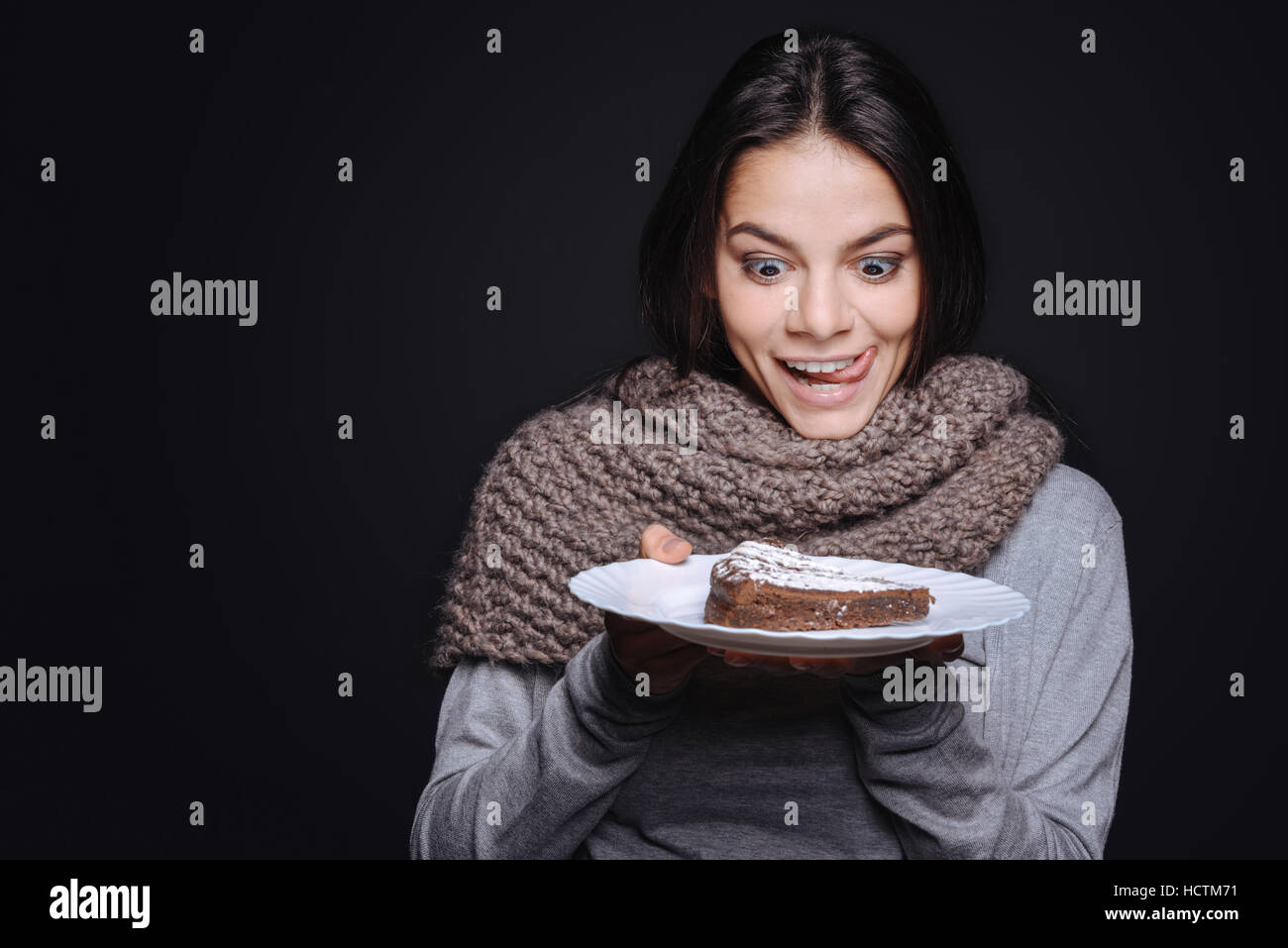 Joyful woman going to eat the piece of cake Stock Photo - Alamy
