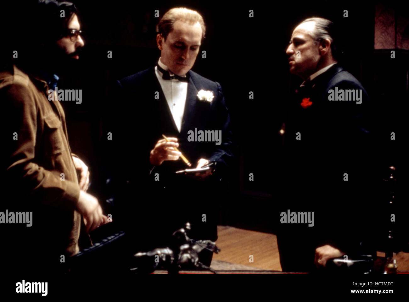 THE GODFATHER, director Francis Ford Coppola, Robert Duvall, Marlon Brando on set, 1972 Stock ...