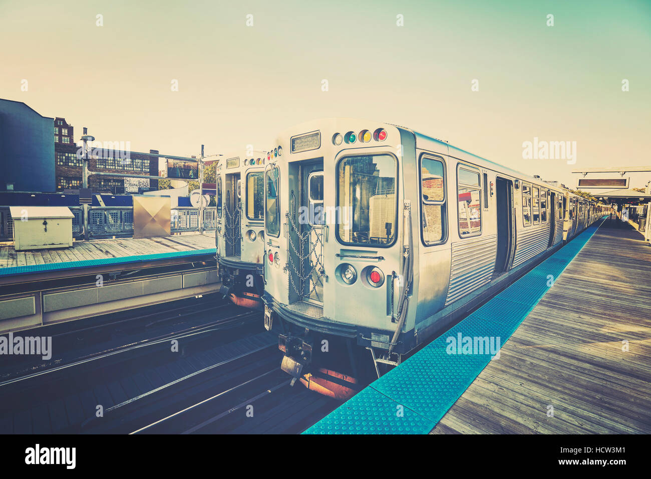 Retro stylized photo of a train on platform in Chicago, USA Stock Photo ...