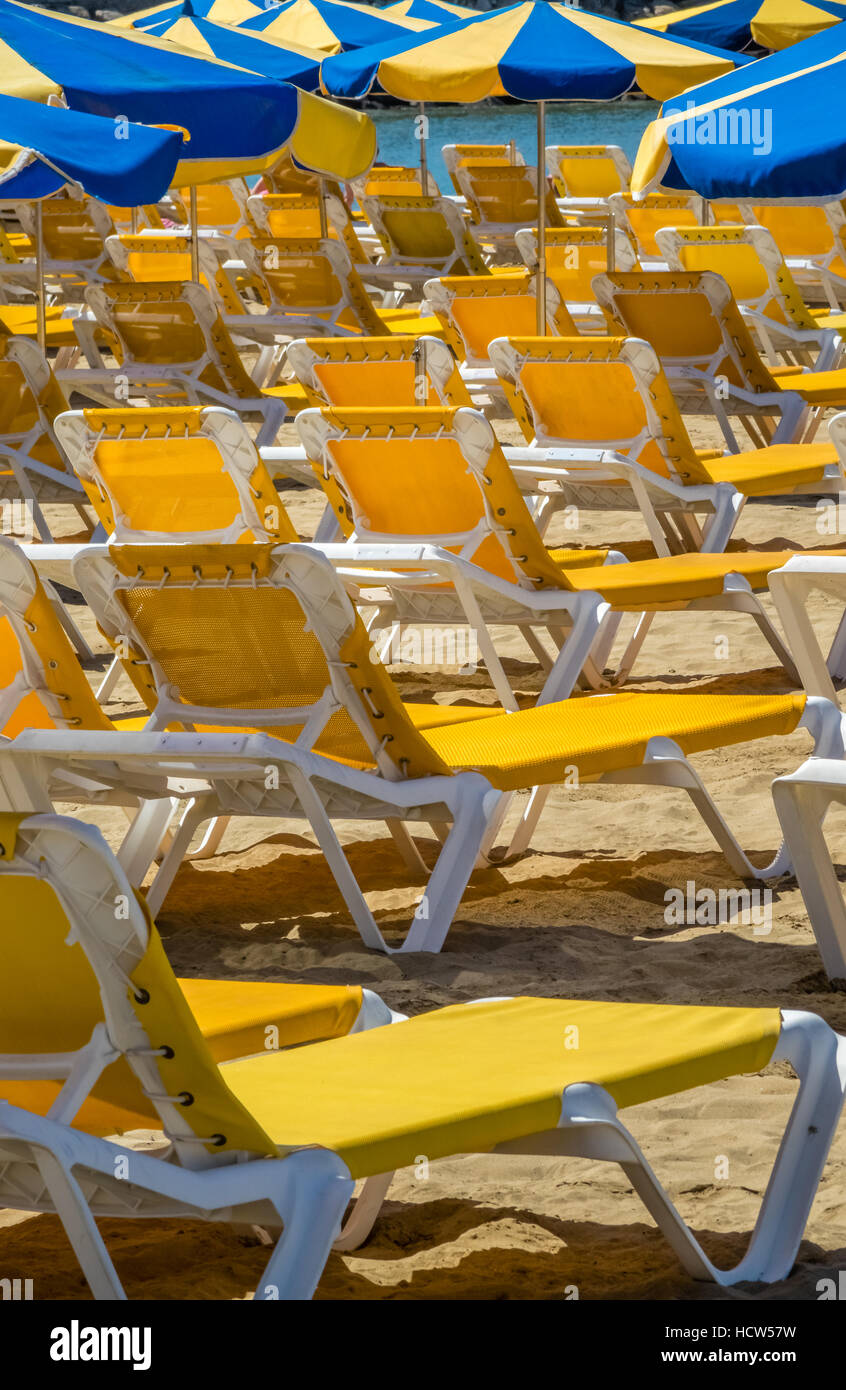 Yellow deck chairs on the Puerto Rico beach in Gran Canaria, Canary ...