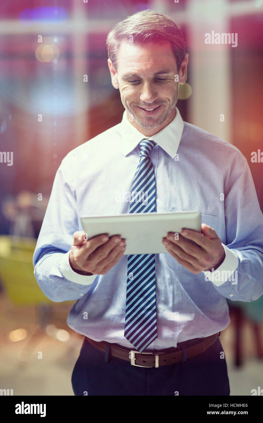 Happy mature businessman tablet hi-res stock photography and images - Alamy