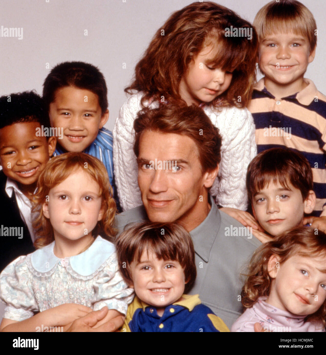 KINDERGARTEN COP, Arnold Schwarzenegger (center), Joseph/Christian ...