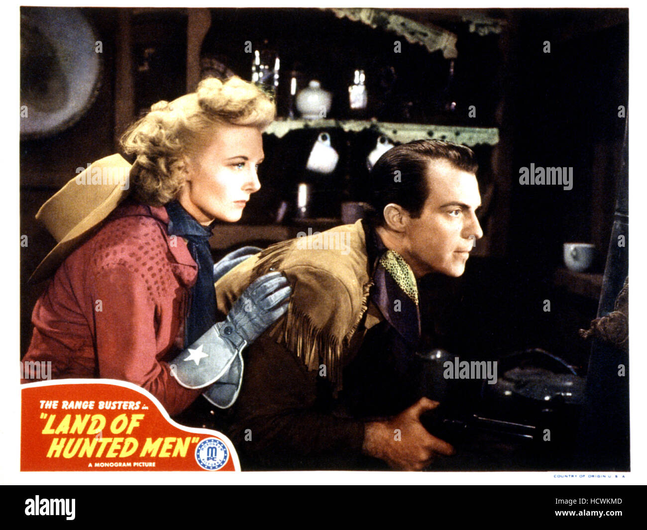 LAND OF HUNTED MEN, from left: Phyllis Adair, Dennis Moore, 1943 Stock ...