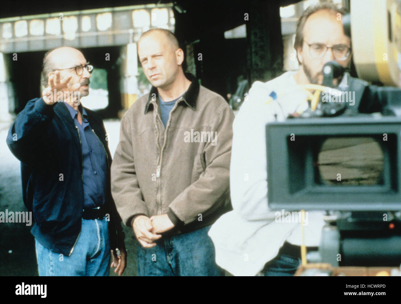 MERCURY RISING, from left: director Harold Becker, Bruce Willis on set ...